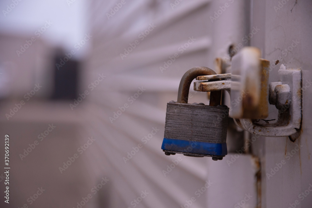 Pad lock securing a trailer handle. Stock Photo | Adobe Stock