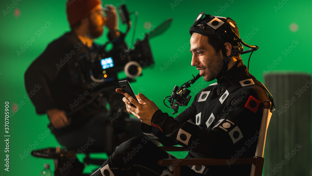 Handsome Smiling Actor Wearing Motion Capture Suit and Head Rig having ...