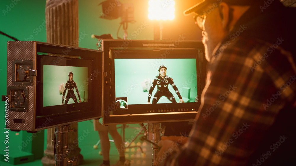 Director Looks at Displays Directs Green Screen CGI Scene with Actor ...