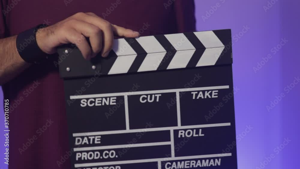 Clapboard on set. Director says action! and the clapboard close down ...