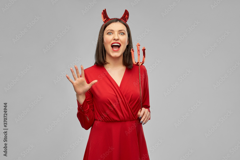 holiday, theme party and people concept - scary woman in red halloween ...