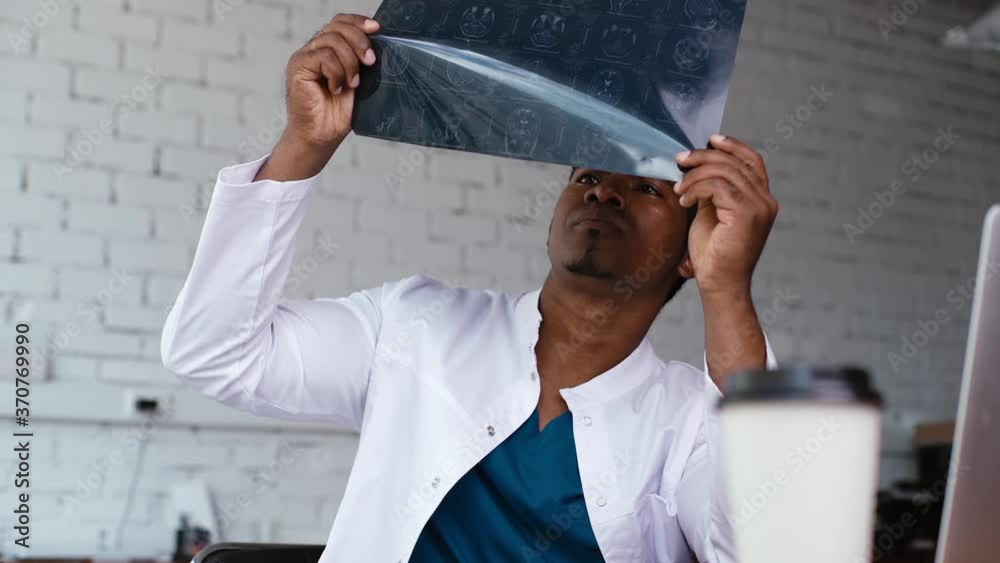 African American black man doctor is analyzing history disease of ...