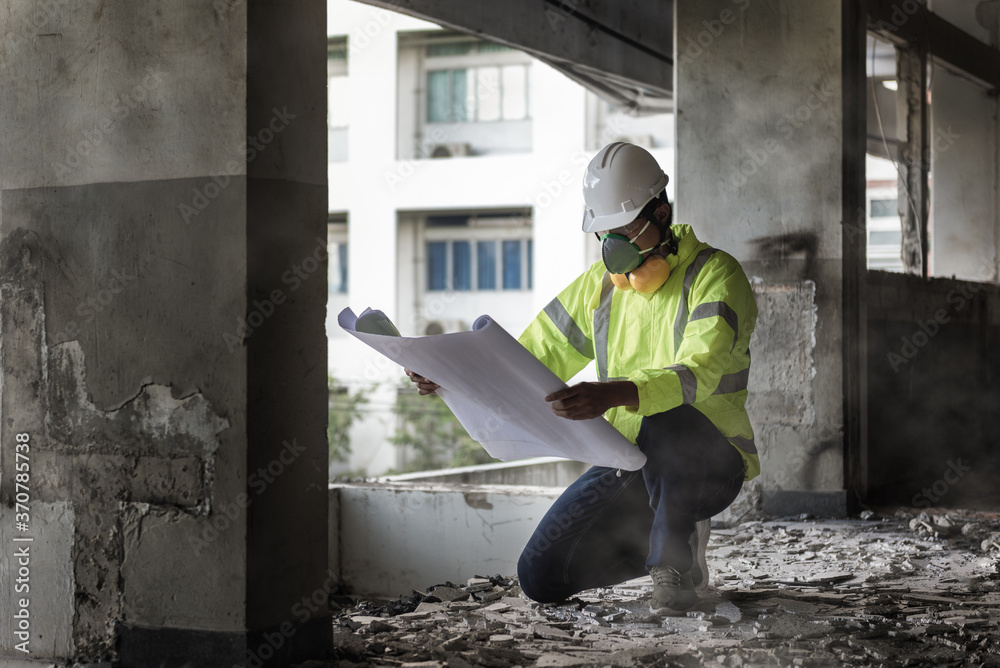 Civil Engineer People wearing face mask and safety helmet while looking ...