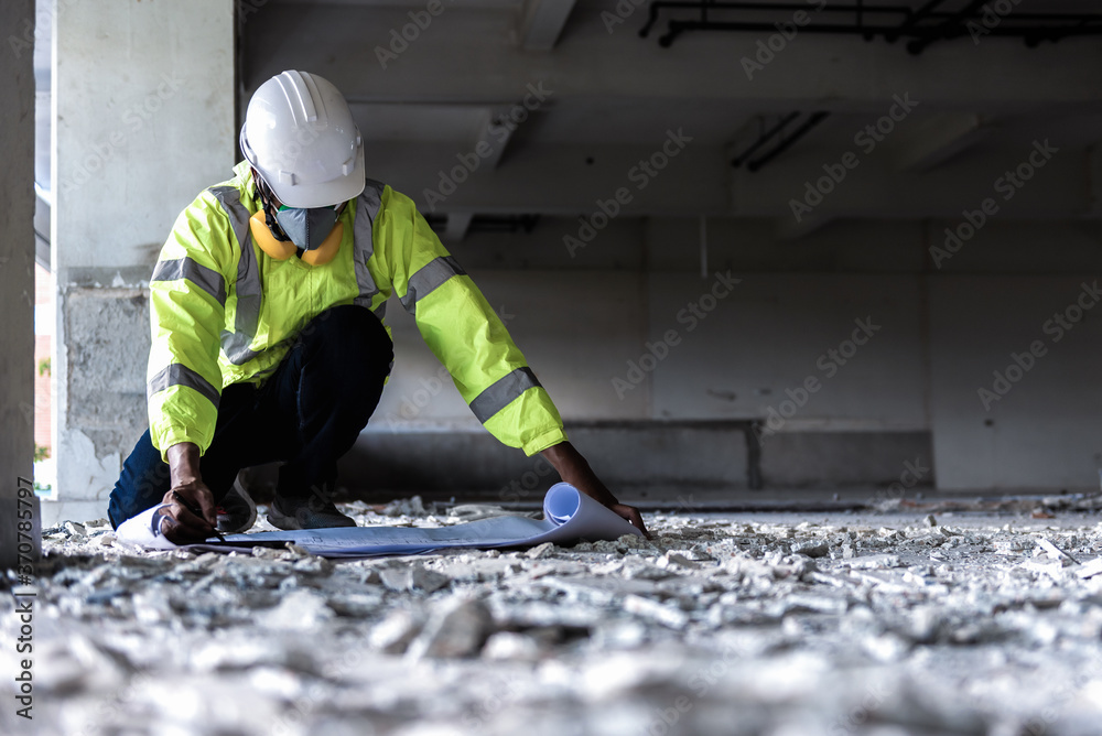 Civil Engineer People wearing face mask and safety helmet while looking ...
