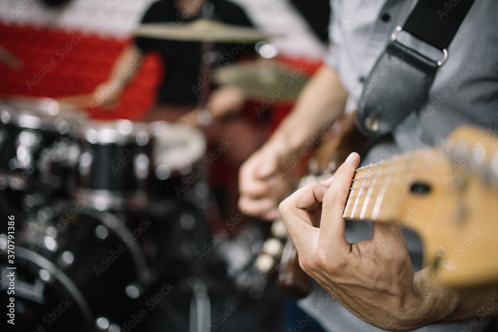 Selective focus image of band playing music instruments. Blurred and ...