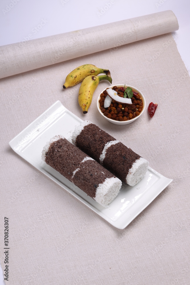 Ragi Puttu or Finger Millet steamed cake with bengal gram curry Stock ...