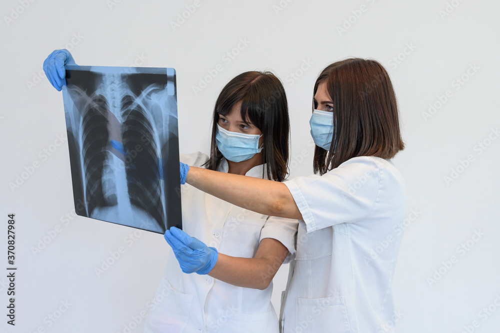 Young doctors checking chest x-ray Stock Photo | Adobe Stock