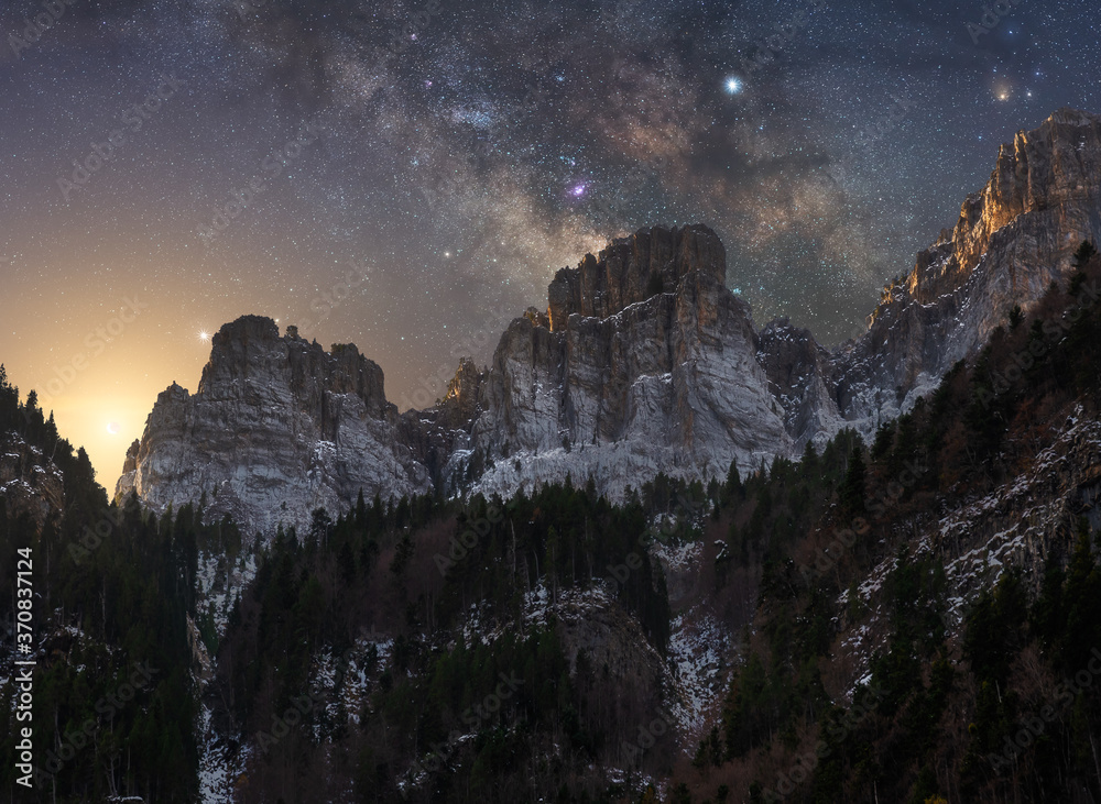 From below amazing scenery of mountain rocky under dark sky with Milky ...