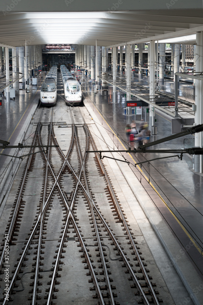 From above modern trains on railroad station near platform with smooth ...