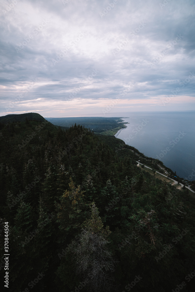 From above of rough cliffs covered with evergreen forest in endless ...