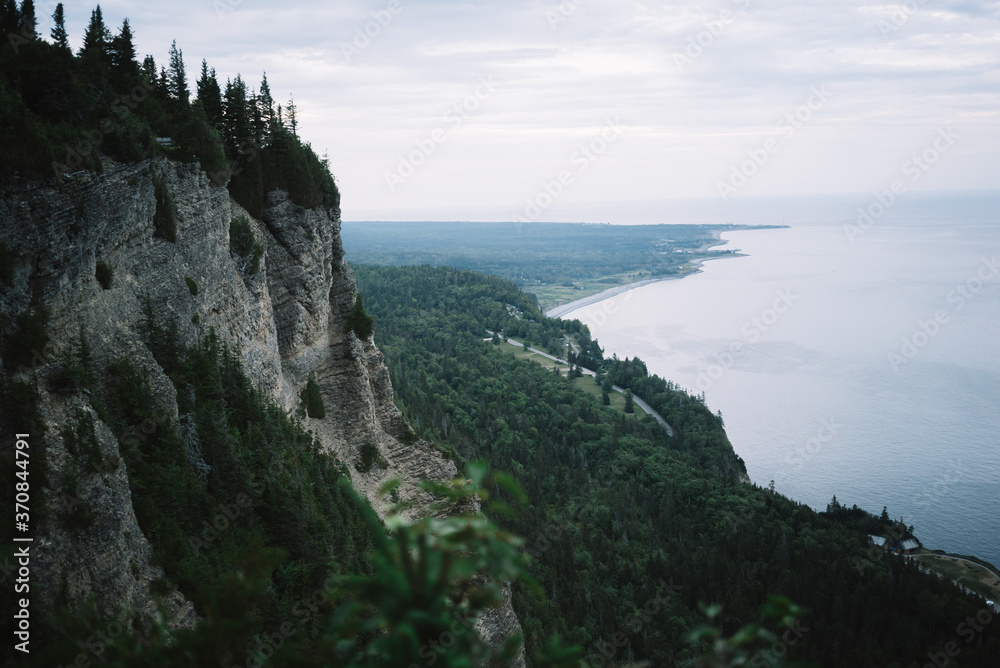 From above of rough cliffs covered with evergreen forest in endless ...