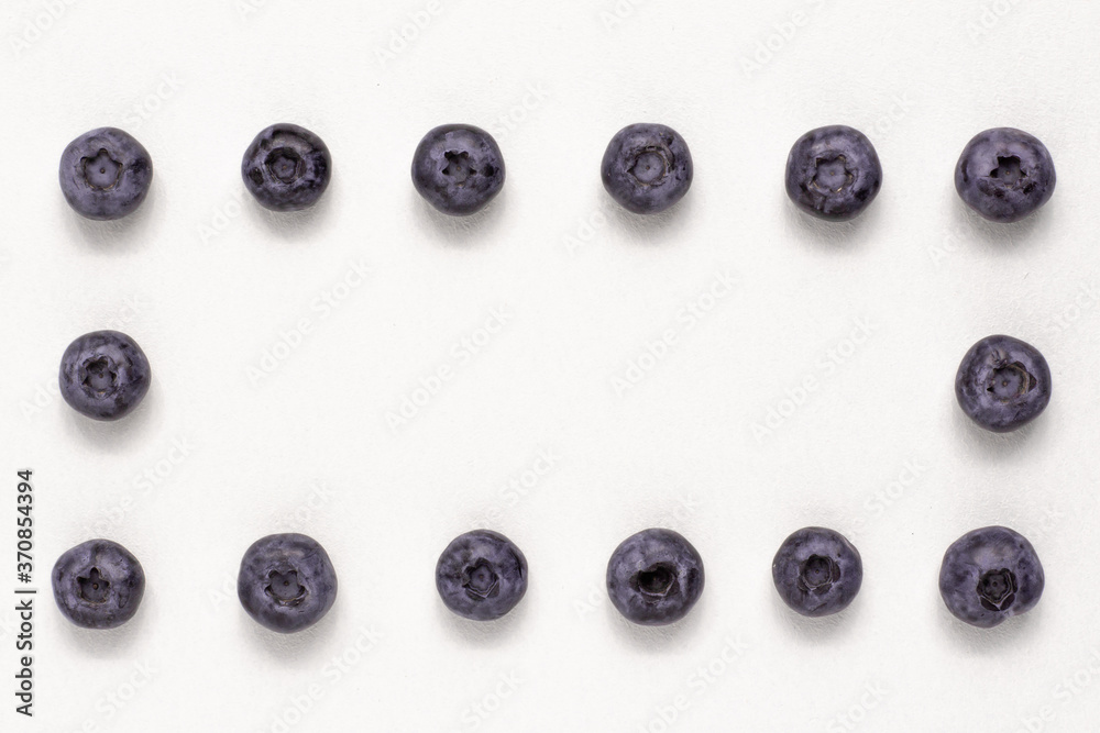 Macro shot blueberry aroun the frame on bright background from adobe ...