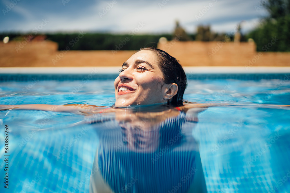Laughing woman in swimming pool Stock Photo | Adobe Stock