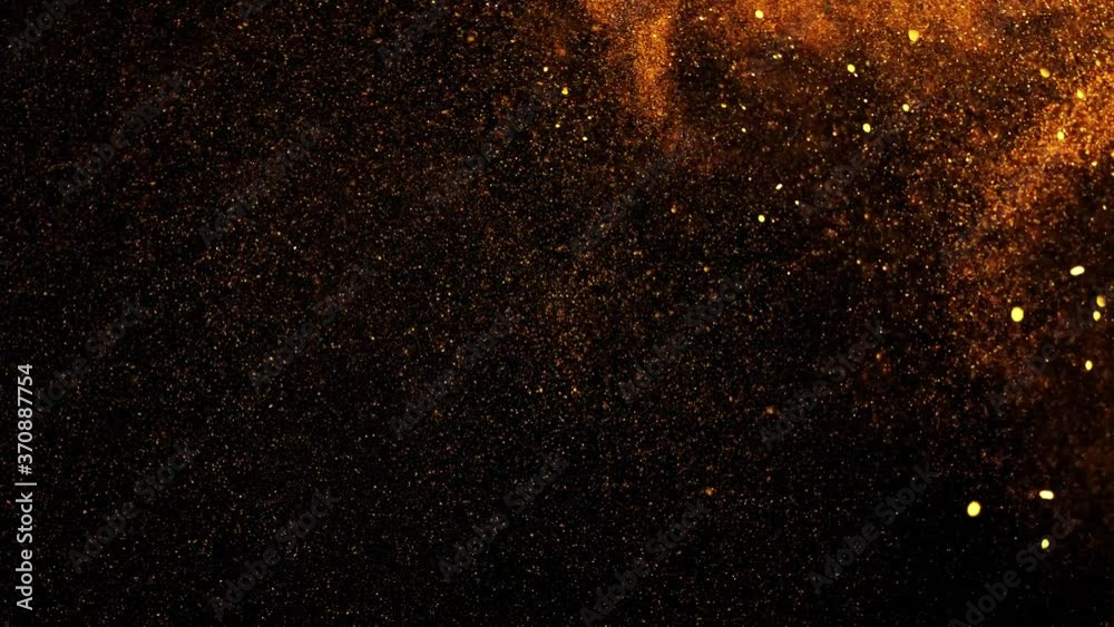 Abstract motion background shining gold particles. Shimmering Glittering Particles With Bokeh ...