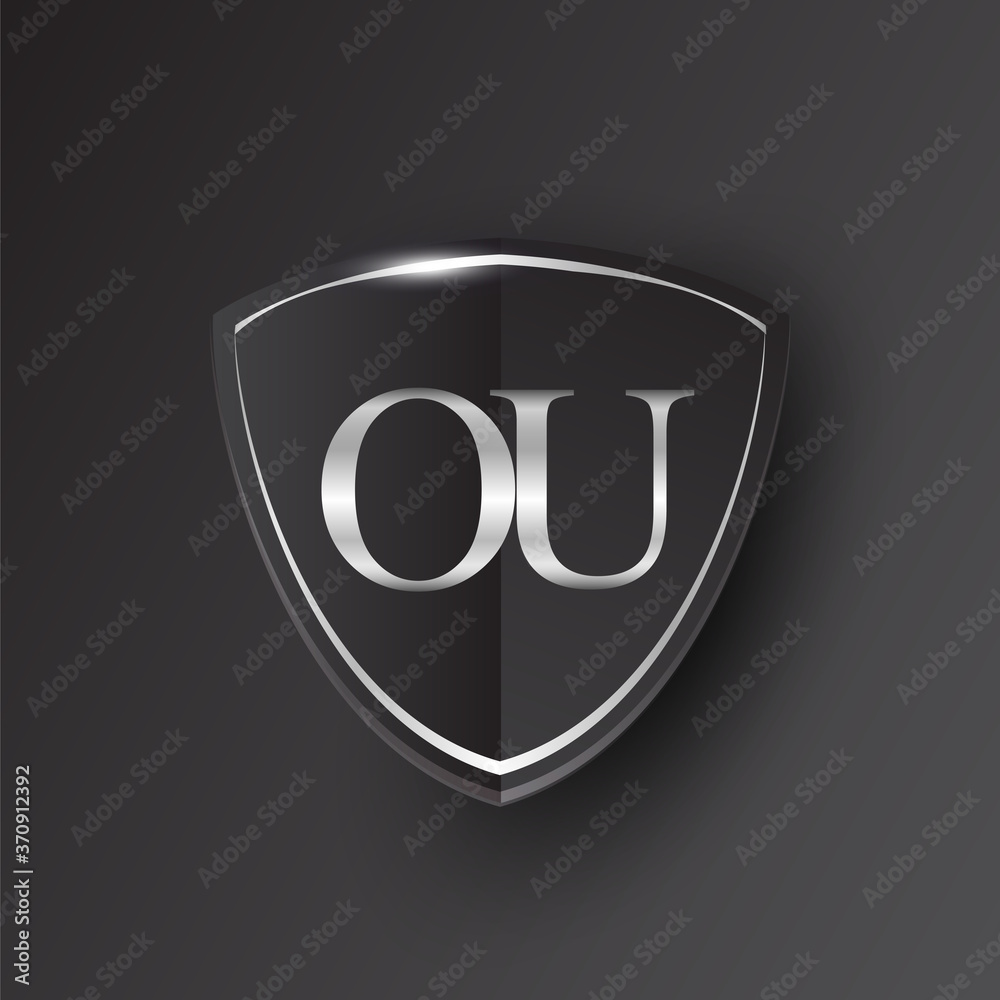 Initial logo letter OU with shield Icon silver color isolated on black ...