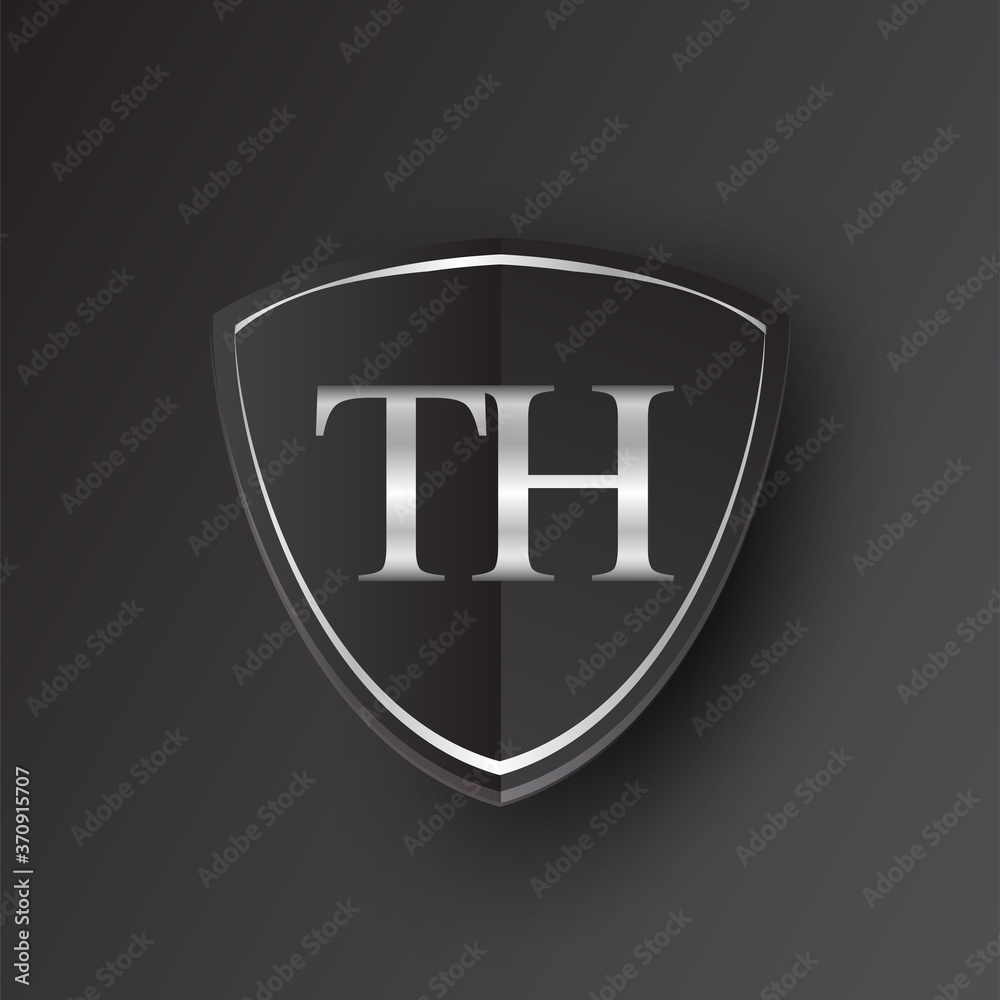 Initial logo letter TH with shield Icon silver color isolated on black ...