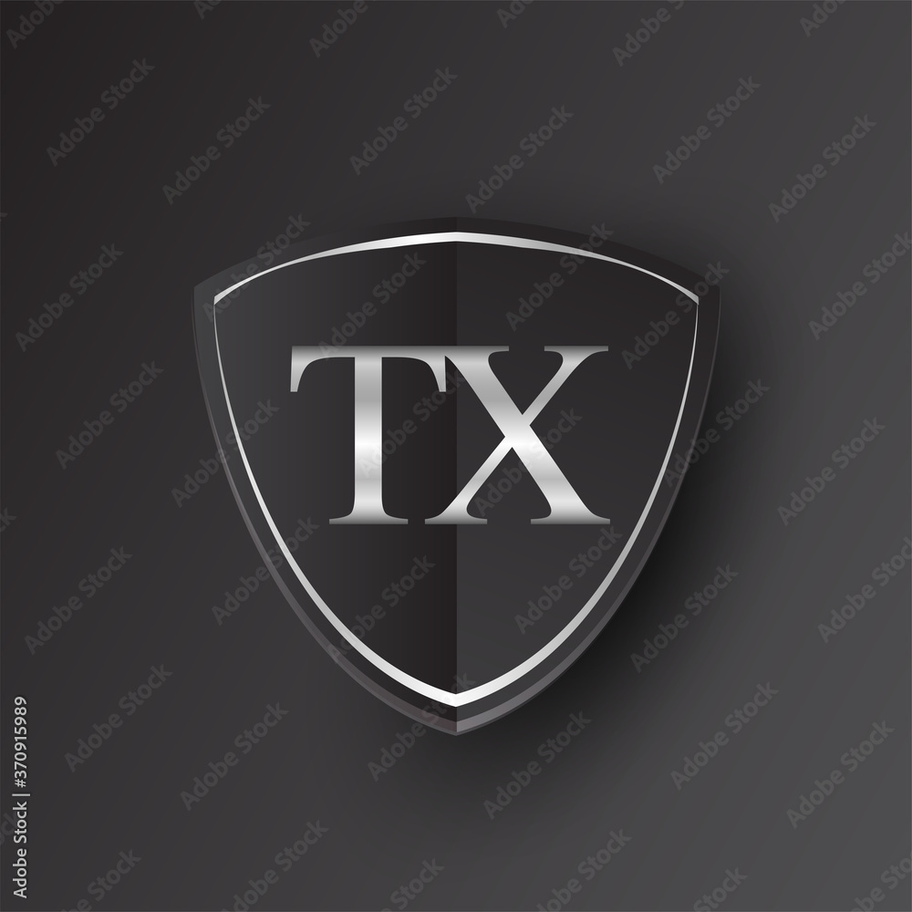 Initial logo letter TX with shield Icon silver color isolated on black ...