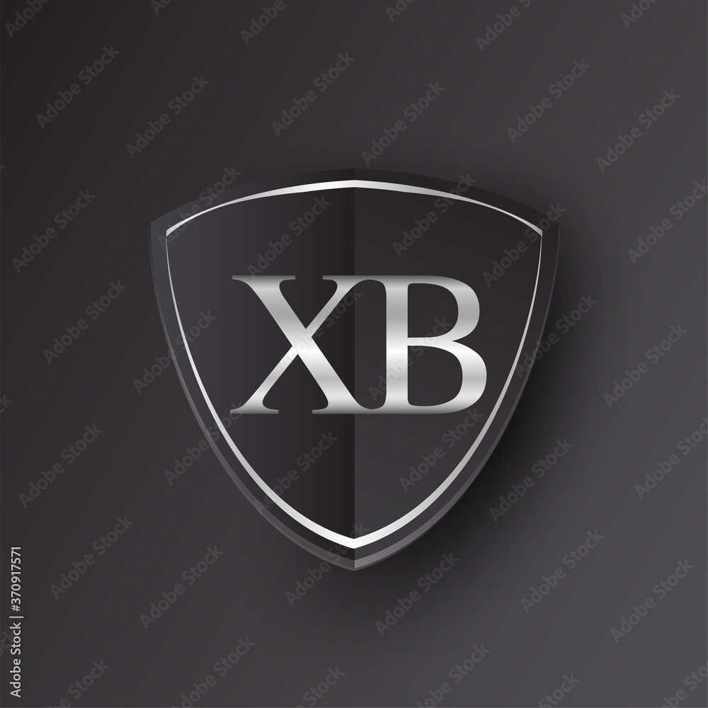 Initial logo letter XB with shield Icon silver color isolated on black ...
