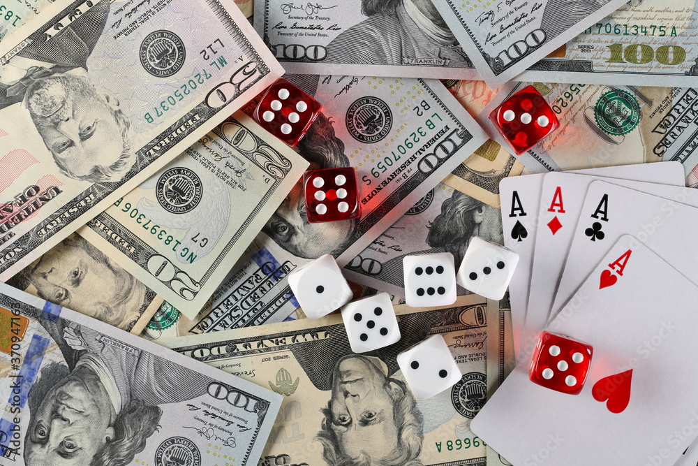 American dollars, banknotes, cash money with playing cards and gambling ...