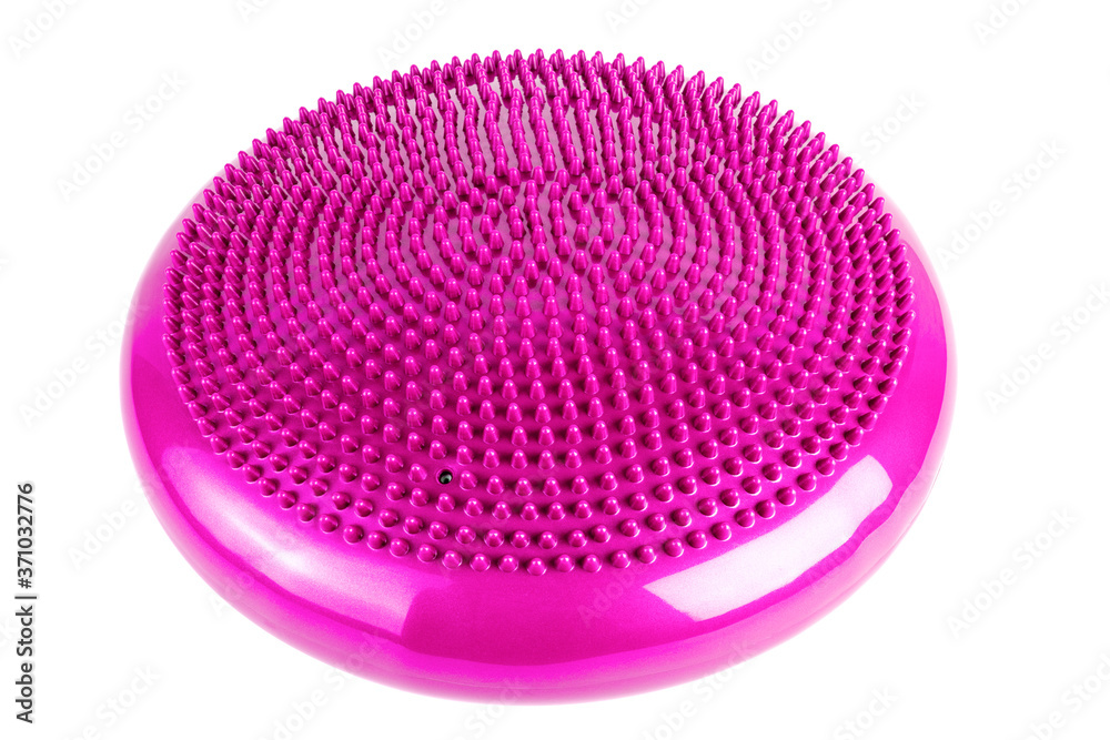 Pink inflatable balance disk isoleated on white background, It is also ...
