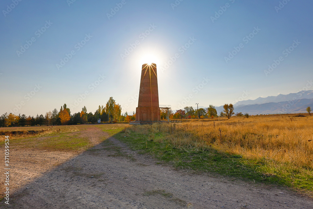 Burana tower, tall and large minaret in the ruins of the ancient site ...