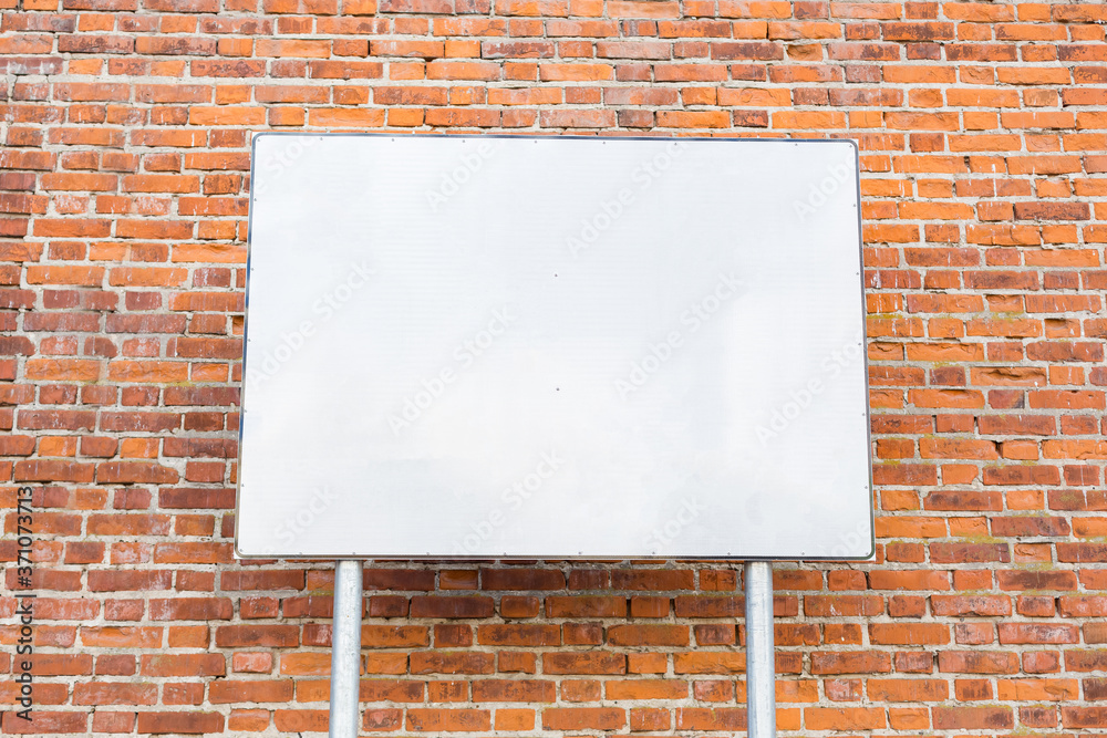 Blank white sign on construction site red brick wall - warning sign ...