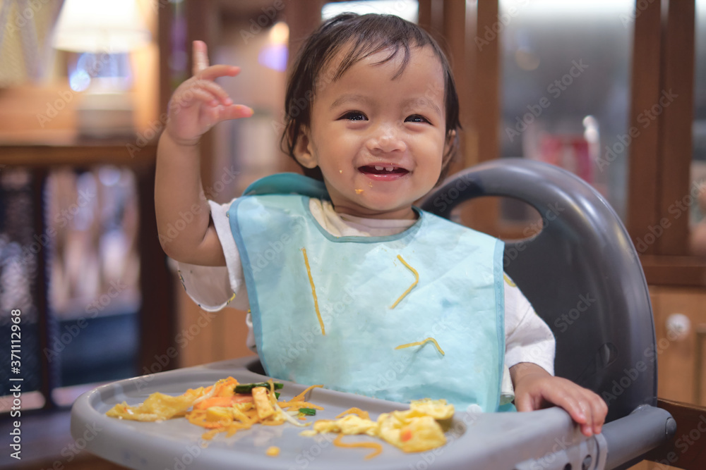 Cute happy smiling Asian toddler baby girl eating by hands, Little kid ...