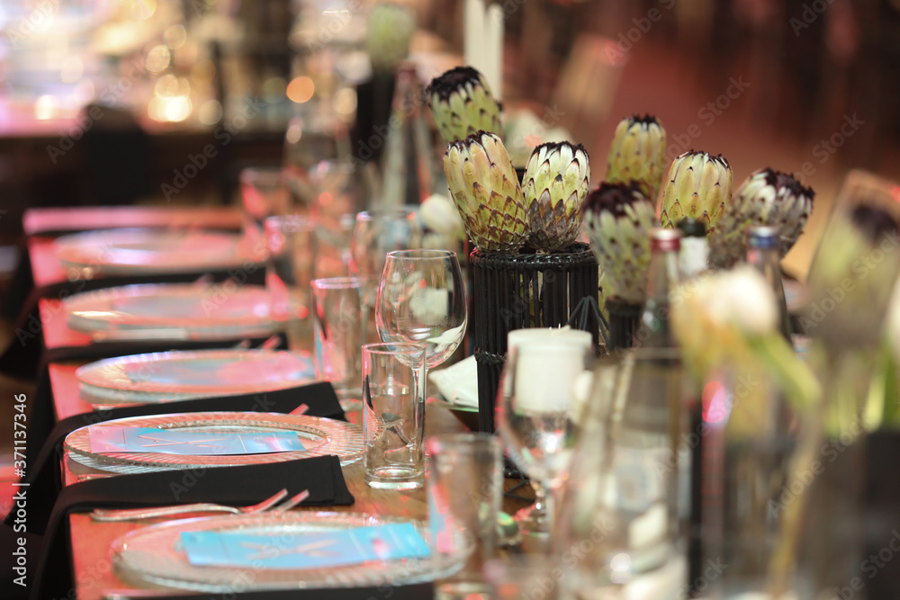 Gala dinner setup with white flowers and blue place cards. Stock Photo ...