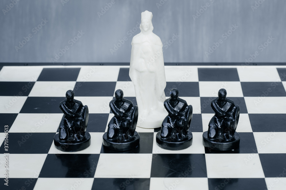 Black and white chess pieces on the chessboard. The concept of ...