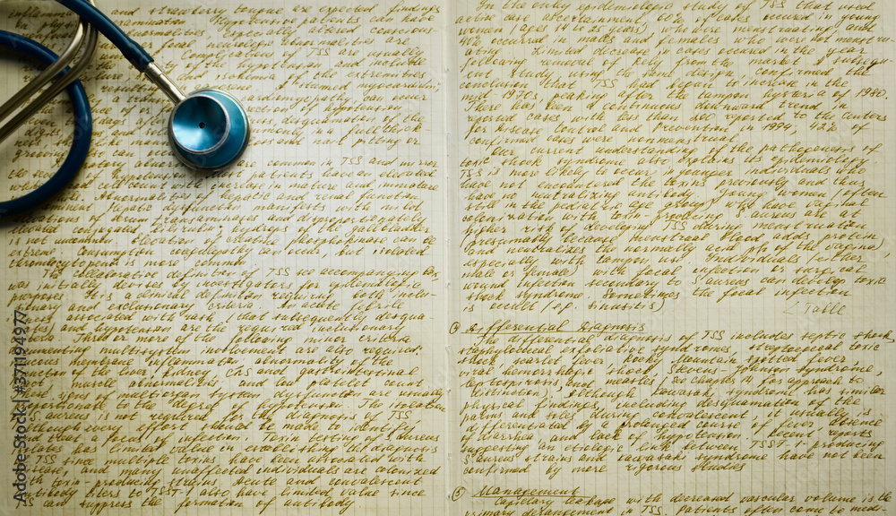 Hand-written medical text. Stethoscope over hand-written medical notes ...
