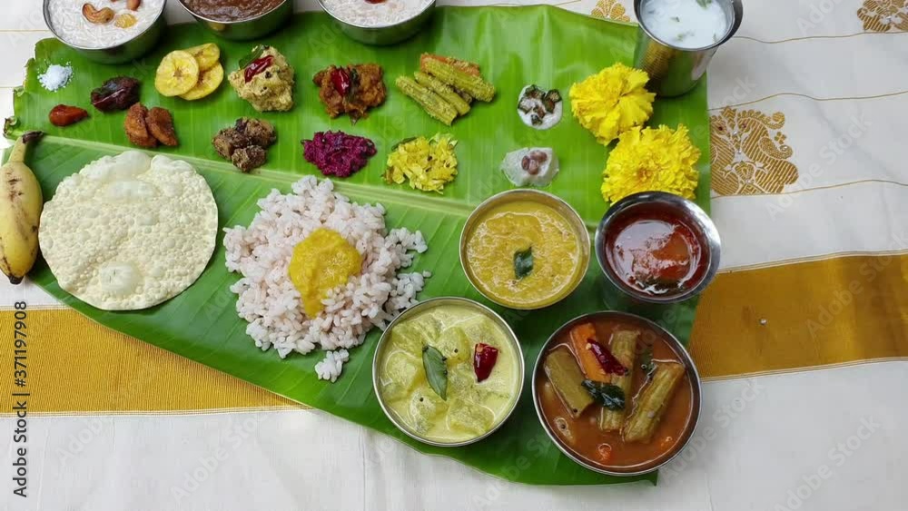 Onam sadhya, traditional Indian lunch boiled rice served on green ...