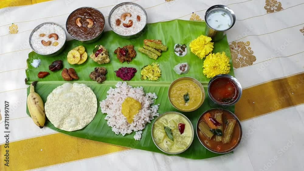 Onam sadhya, traditional Indian lunch boiled rice served on green ...