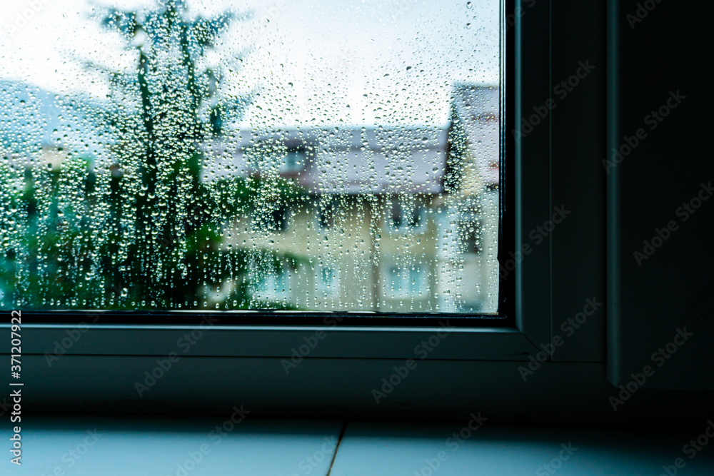 Macro raindrops vapor on window glass. Rain drops on window glasses ...