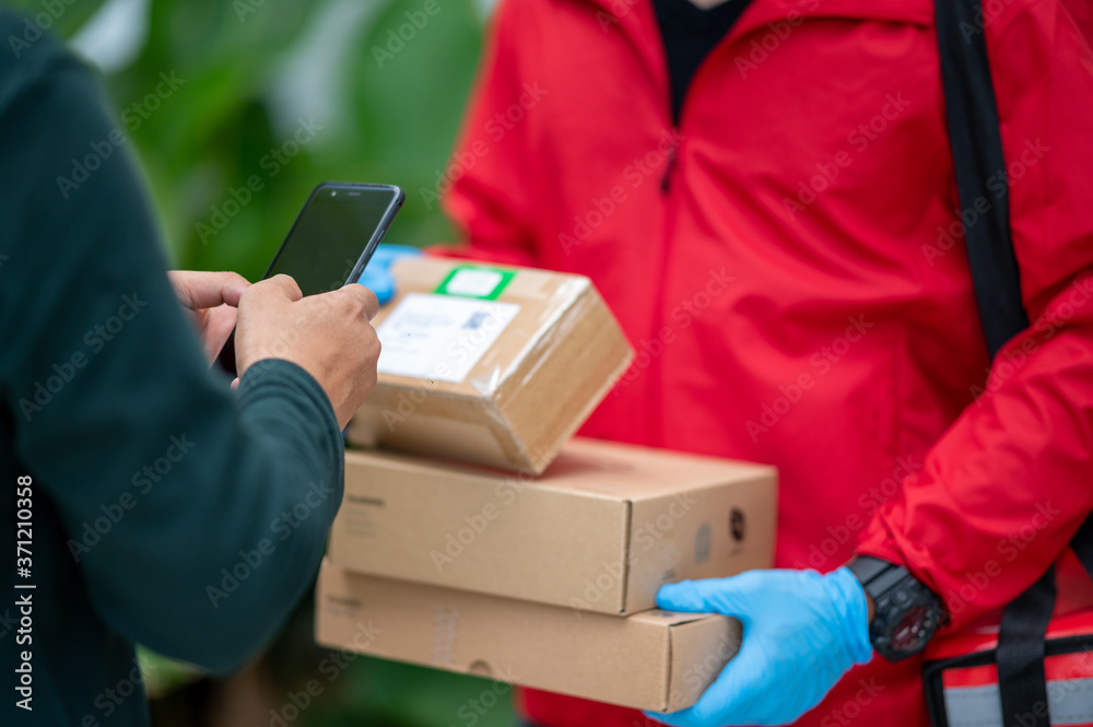 Male Customer Scanning Bar With Phone Code To Receive Products From male-customer-scanning-bar-with-phone-code-to-receive-products-from
