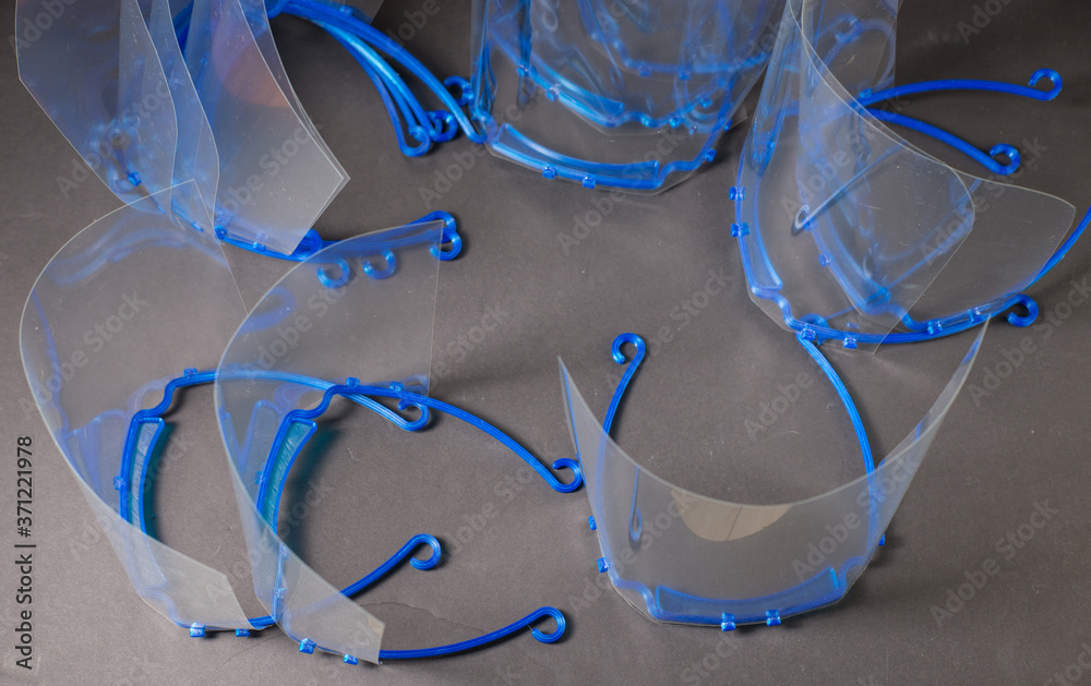 A number of 3d printed face shields, completed assembly with ...