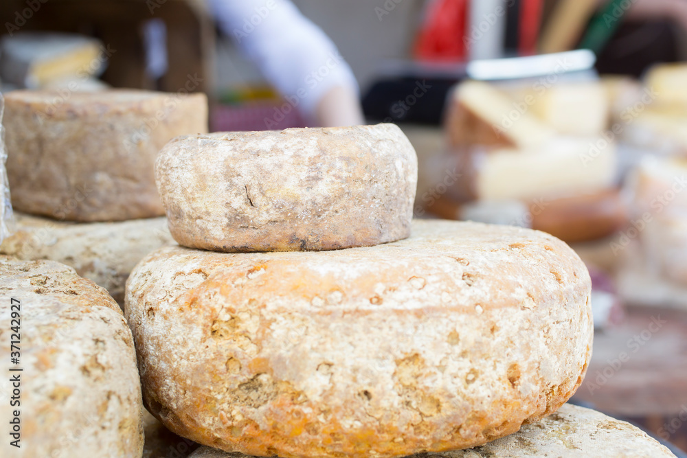 French Comte cheese wheel crusts aging for months Stock Photo | Adobe Stock