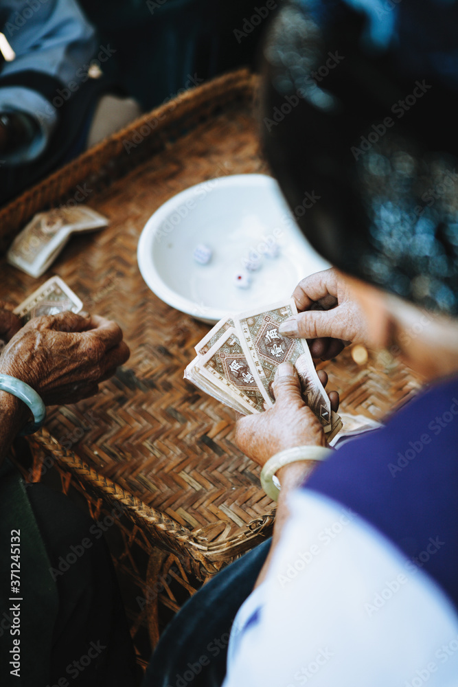 People playing dice in China Stock Photo | Adobe Stock