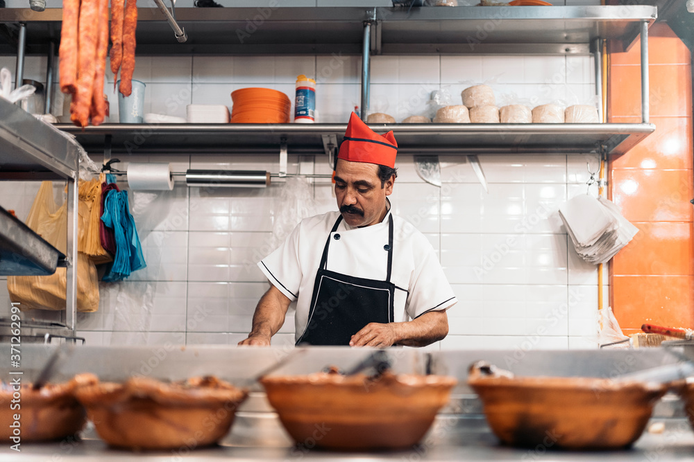 Taquero making tacos Stock Photo | Adobe Stock