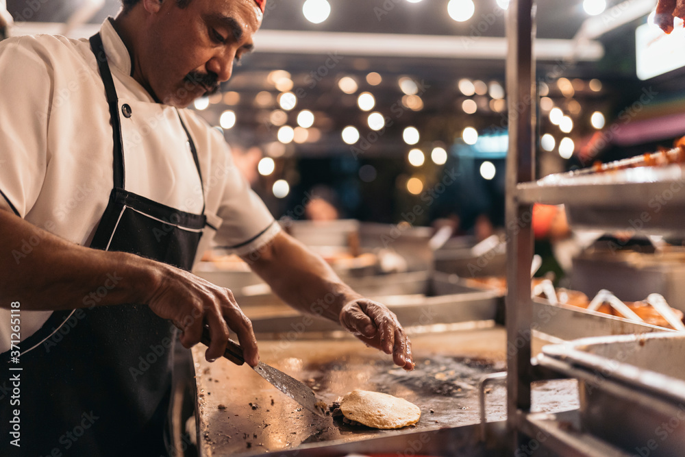 Taquero making tacos Stock Photo | Adobe Stock