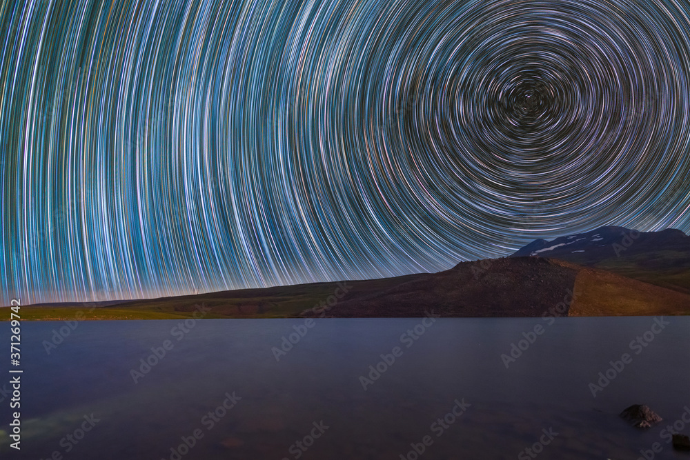 Long exposure night landpscpe. Beautiful small lake and mountains. The ...