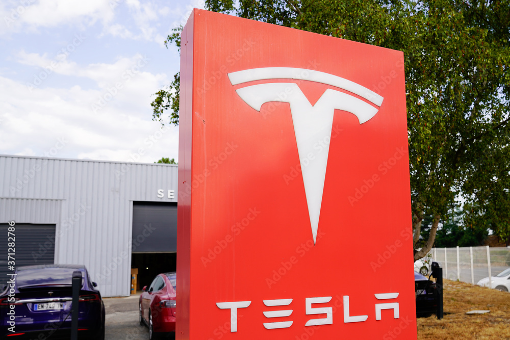 Tesla car branding sign and red logo store showroom dealership electric ...
