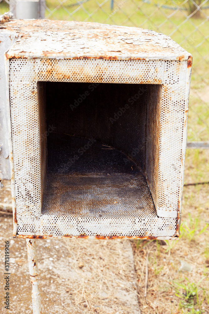 Old rusty ventilation duct mine with grey cracked paint, dust and ...