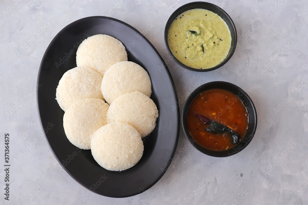 South Indian breakfast dish Idli with Coconut Chutney and sambar. Idly ...