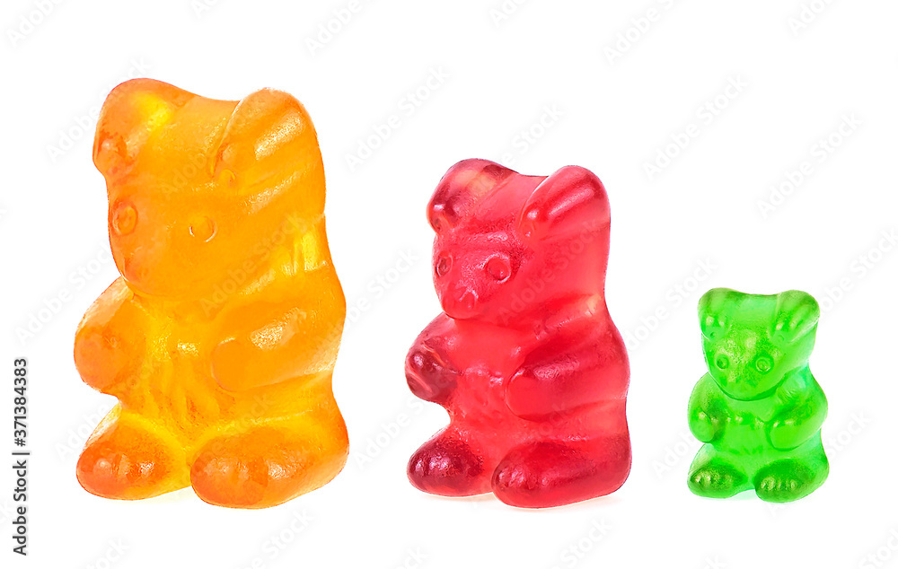 Different sizes and color of jelly gummy bears isolated on a white ...