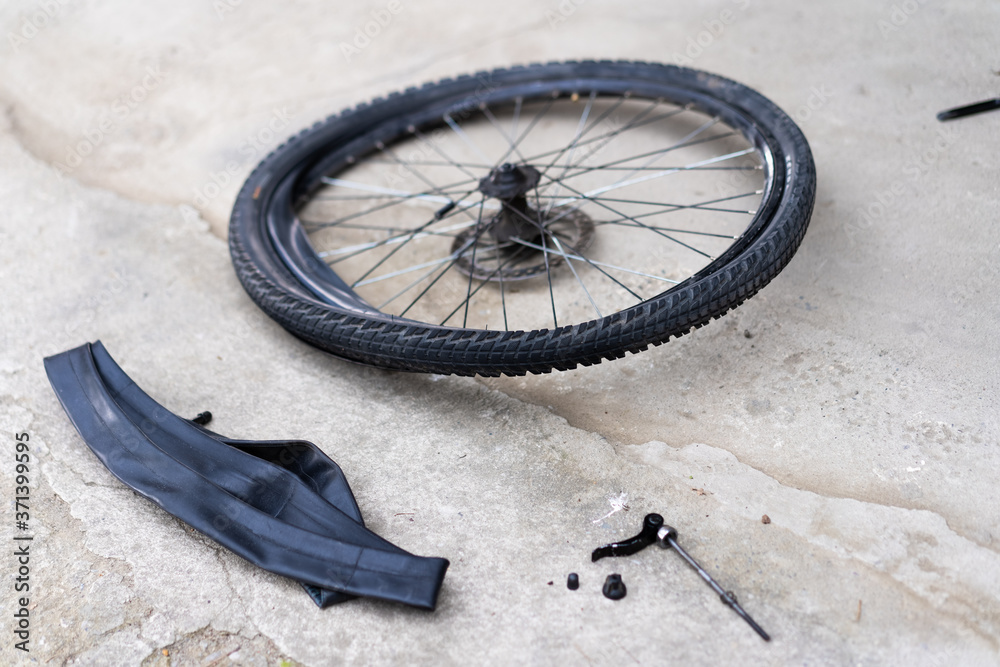 Replacing a bicycle wheel tube Stock Photo | Adobe Stock