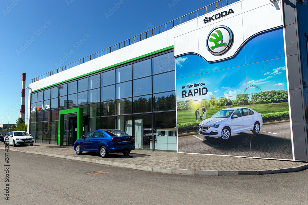 Skoda dealership with modern facade and cars on display in front of the ...