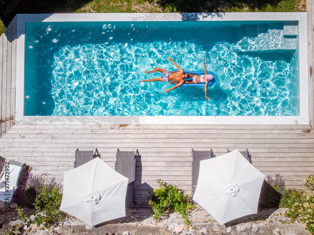 two person swim in the pool at the hotel. View from above, couple men ...