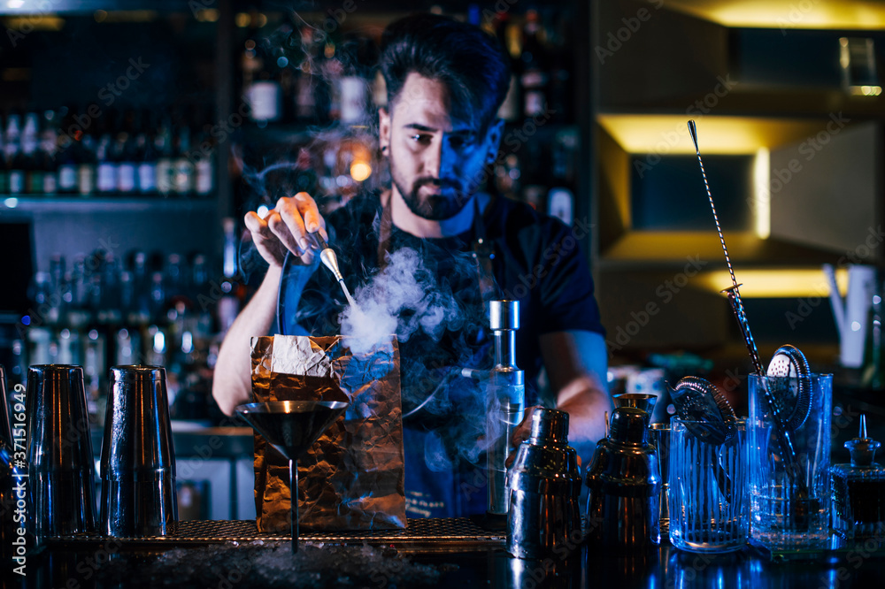 Bartender making cocktail on bar counter in nightclub Stock Photo ...