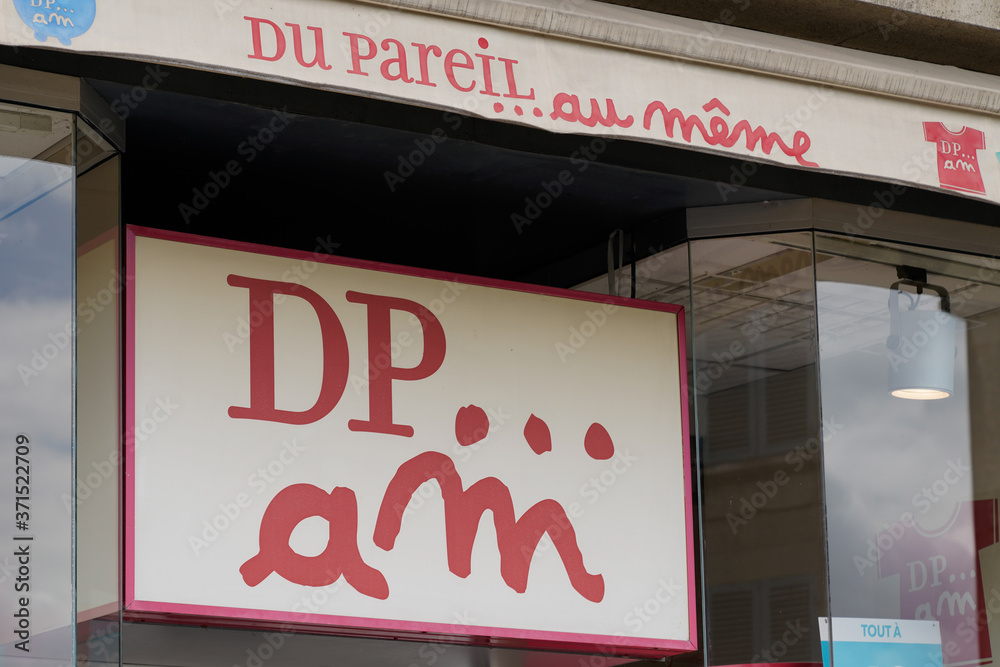 DP...AM Du Pareil Au Même red sign and text logo DPAM of shop for ...