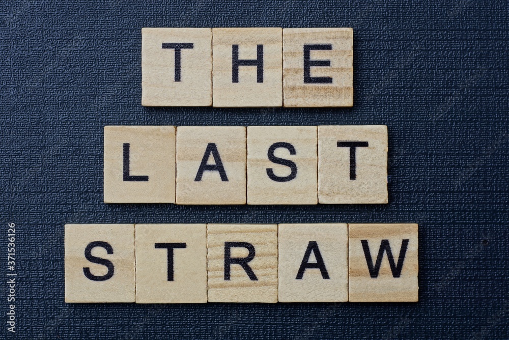 phrase the last straw in small square wooden letters with font on a ...